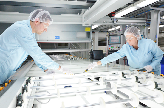 AGNORA Employees Laminating Oversize Glass in the Lamination Clean Room ...